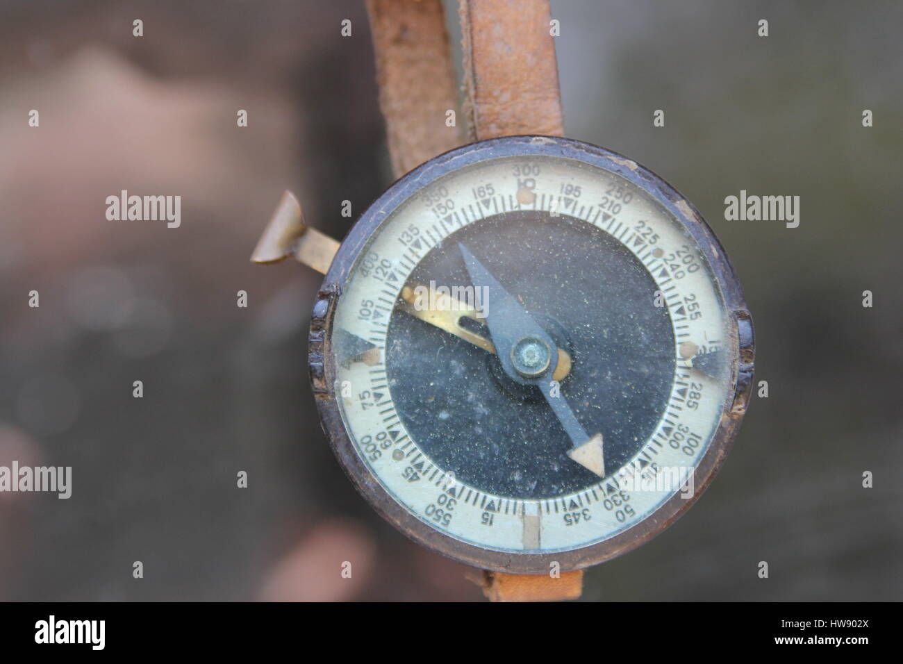 Old Military compass hanging on leather strap Stock Photo - Alamy