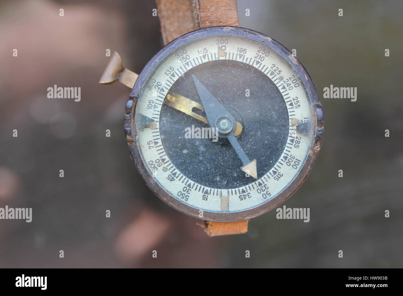 Old Military compass hanging on leather strap Stock Photo - Alamy