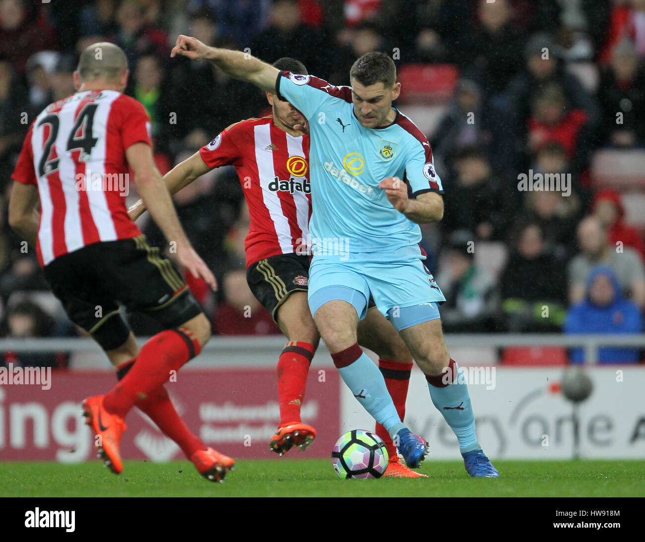 Burnley's Sam Vokes (right) and Sunderland's John O'Shea battle for the ...