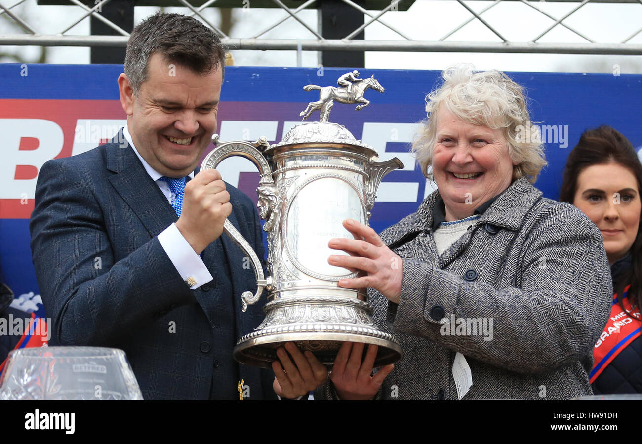 Owner of Chase The Spud Christine Banks lifts the trophy for winning ...