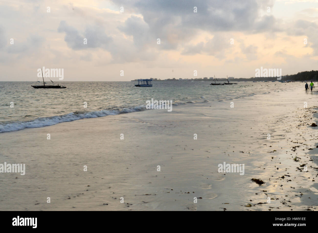 View of the beach and ocean at sunrise in Bamburi, Kenya Stock Photo ...