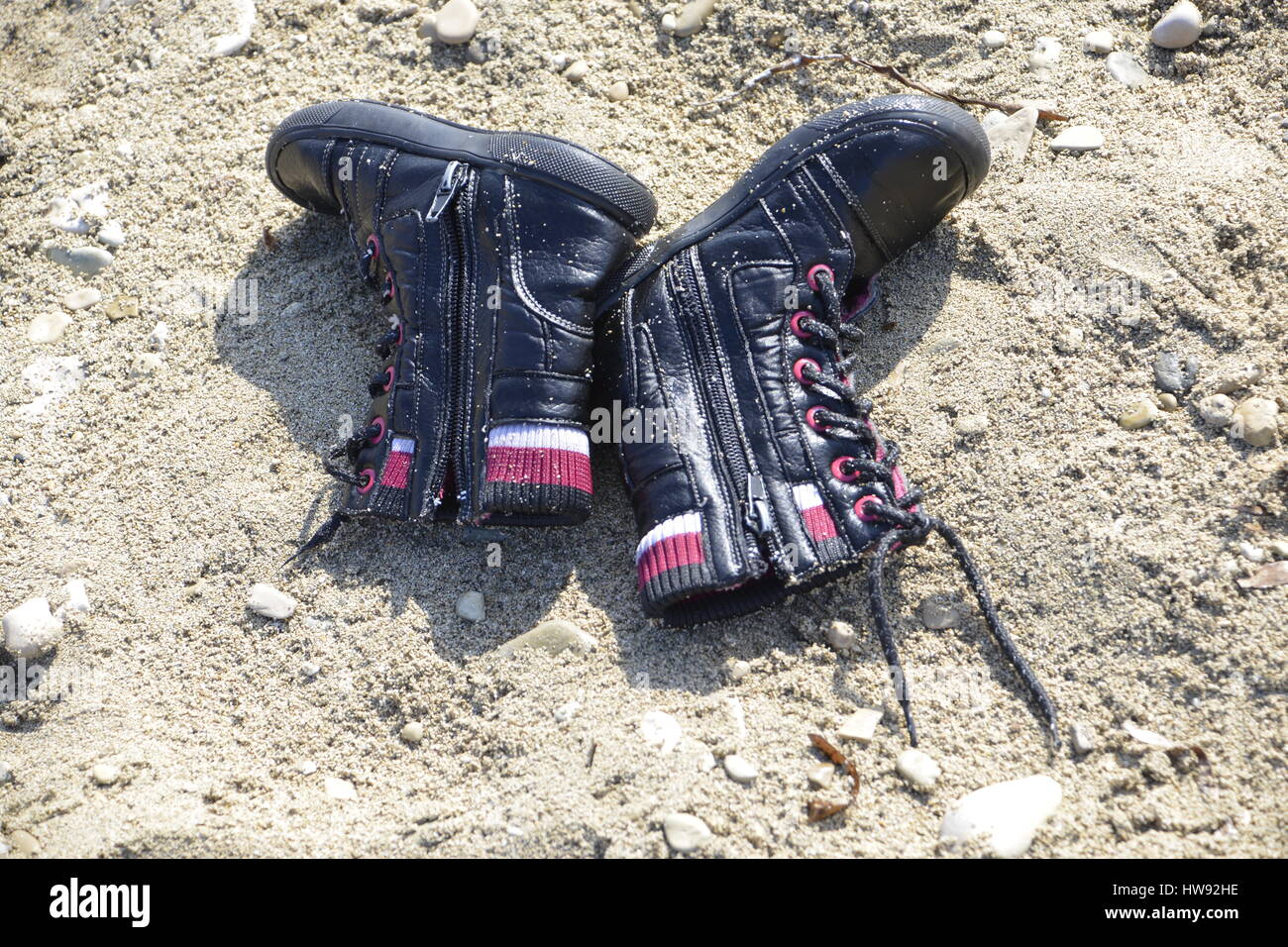 shoes, materials from refugees wash ashore at Lesvos Greece Stock Photo ...