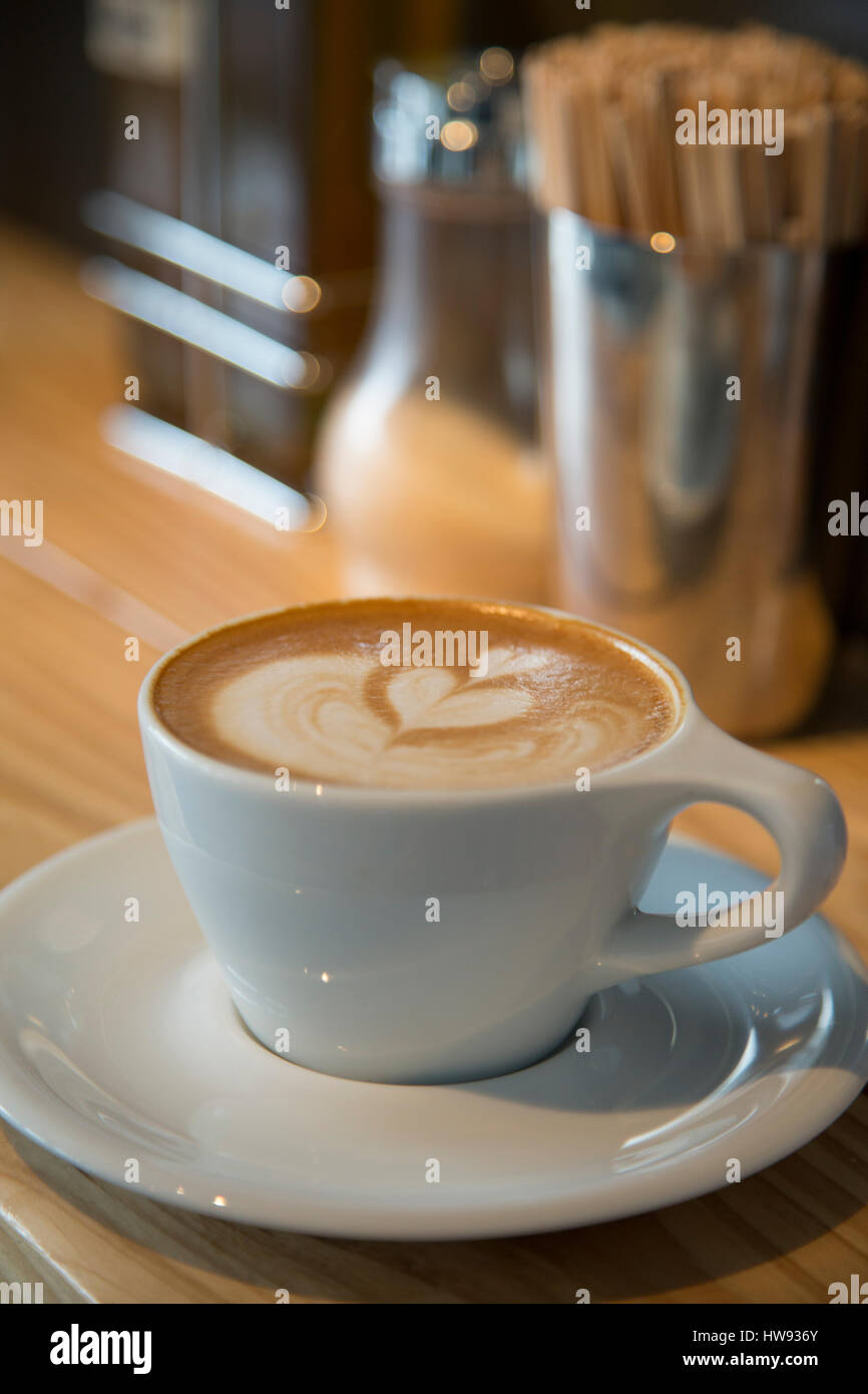 Cappuccino in a cafe Stock Photo - Alamy