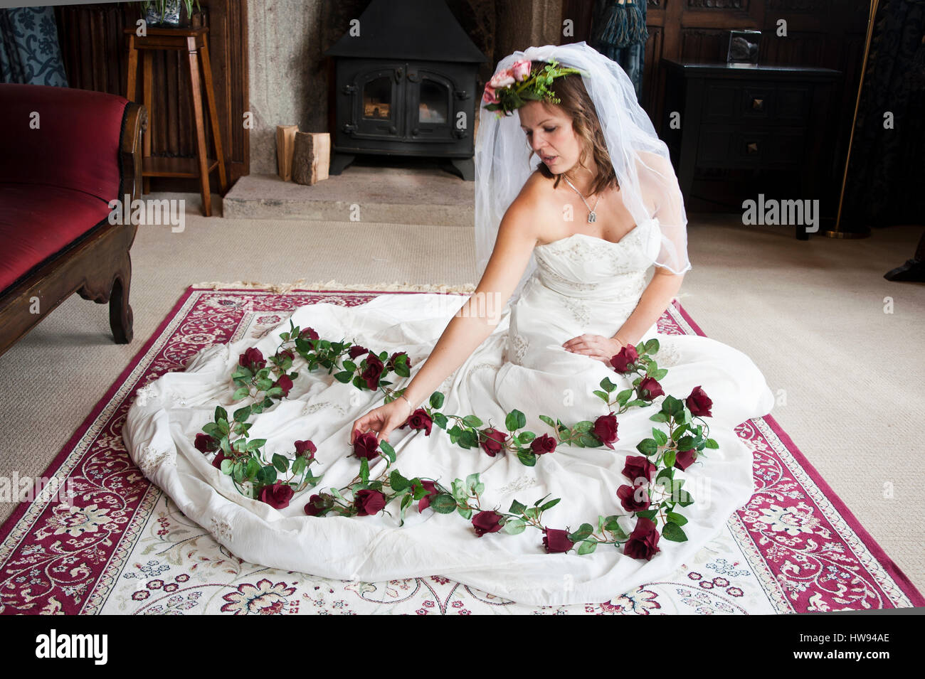 Woman wearing wedding dress kneeling hi-res stock photography and ...