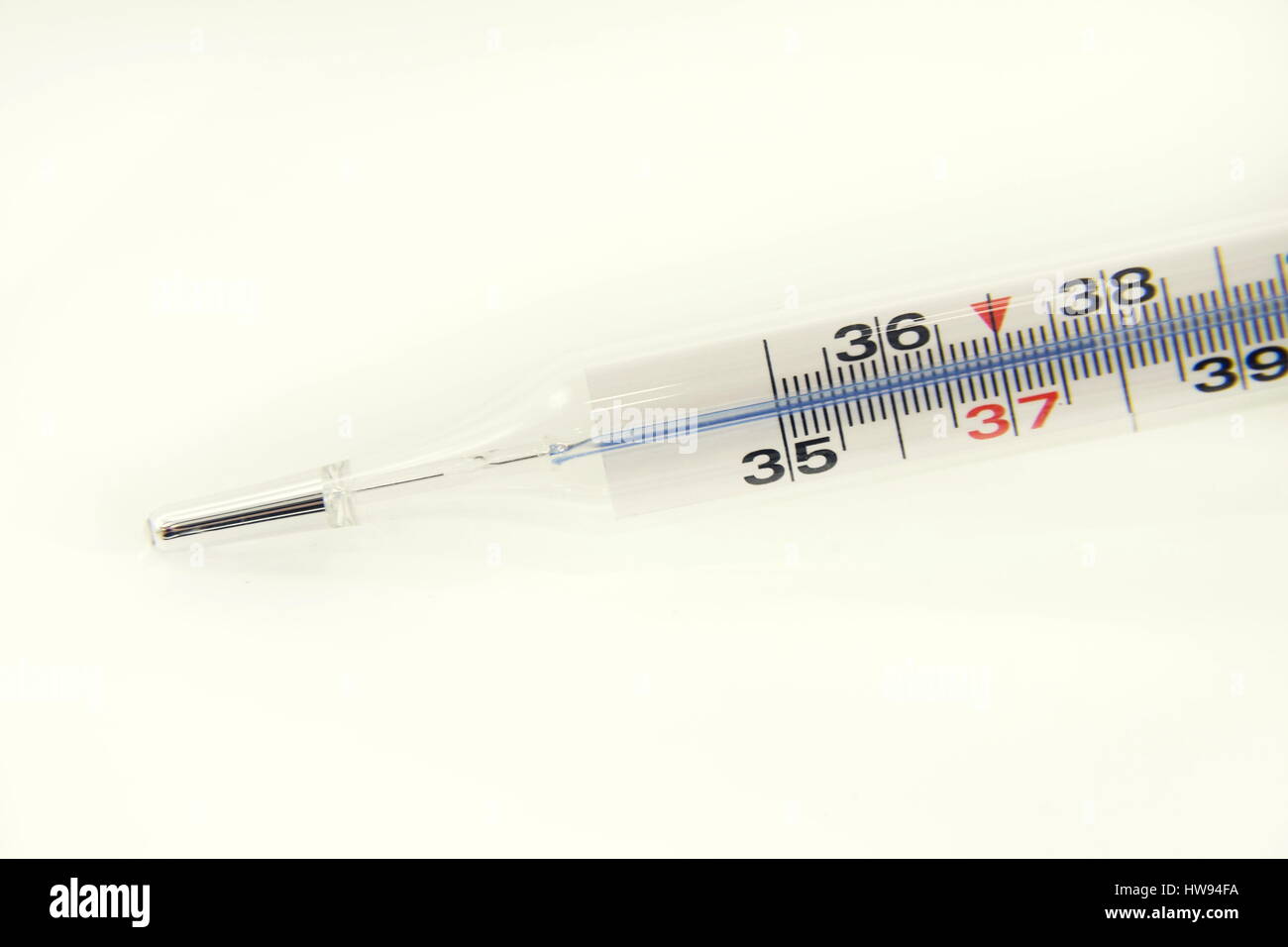 Medical thermometer indicating temperature 37.8 Celsius degrees ...