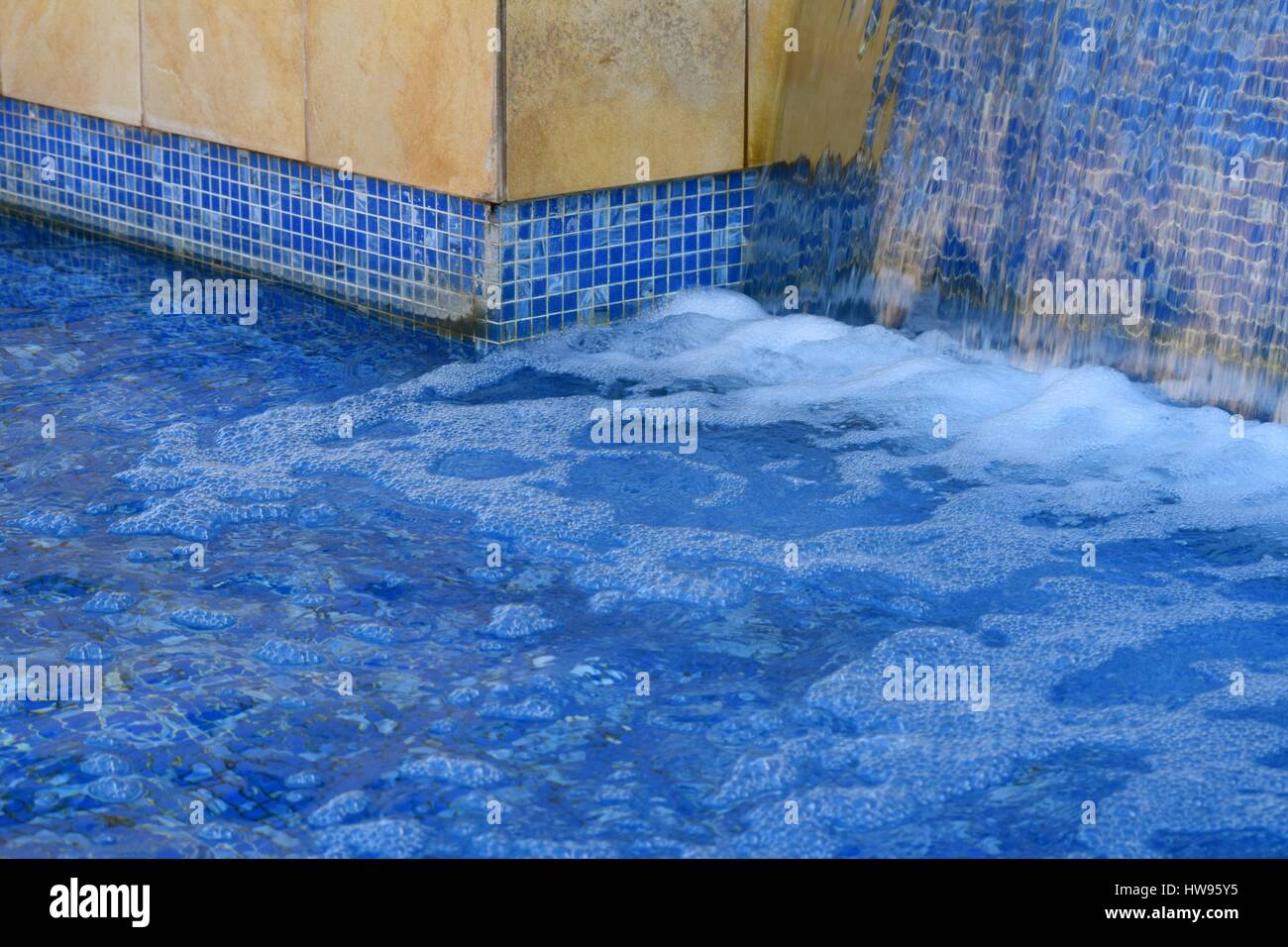 Water Feature / Blue tiles under the water fall bringing a cool ...