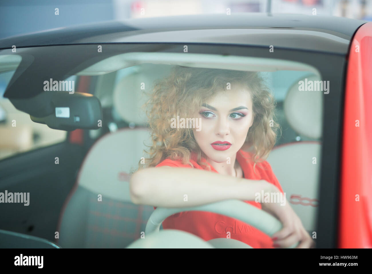 Front View of young Woman Driving Microcar Stock Photo - Alamy