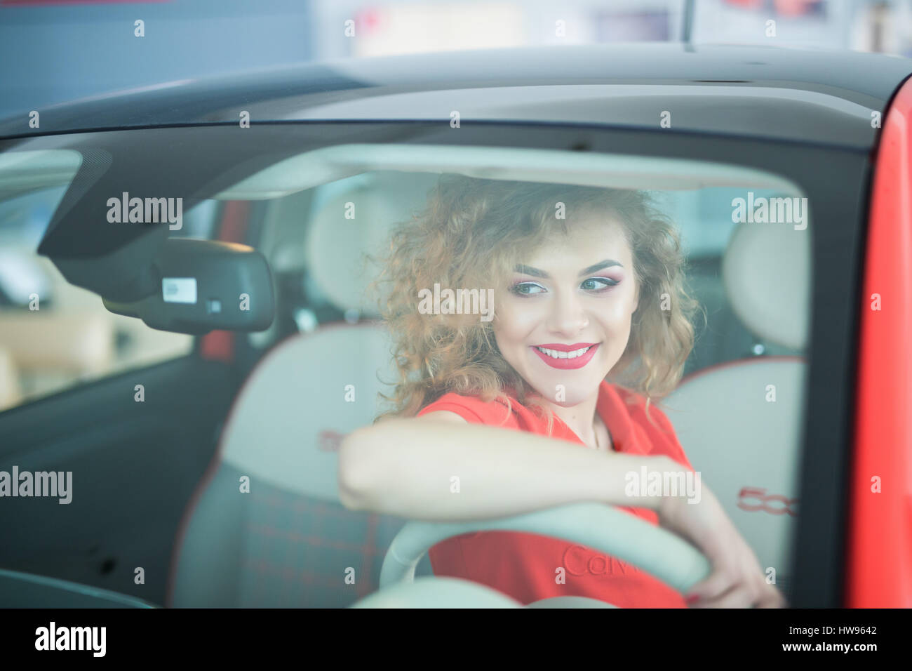 Front View of young Woman Driving Microcar Stock Photo - Alamy
