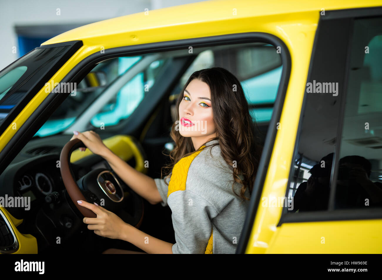 Beautiful Smiling woman driving car, attractive girl sitting in ...