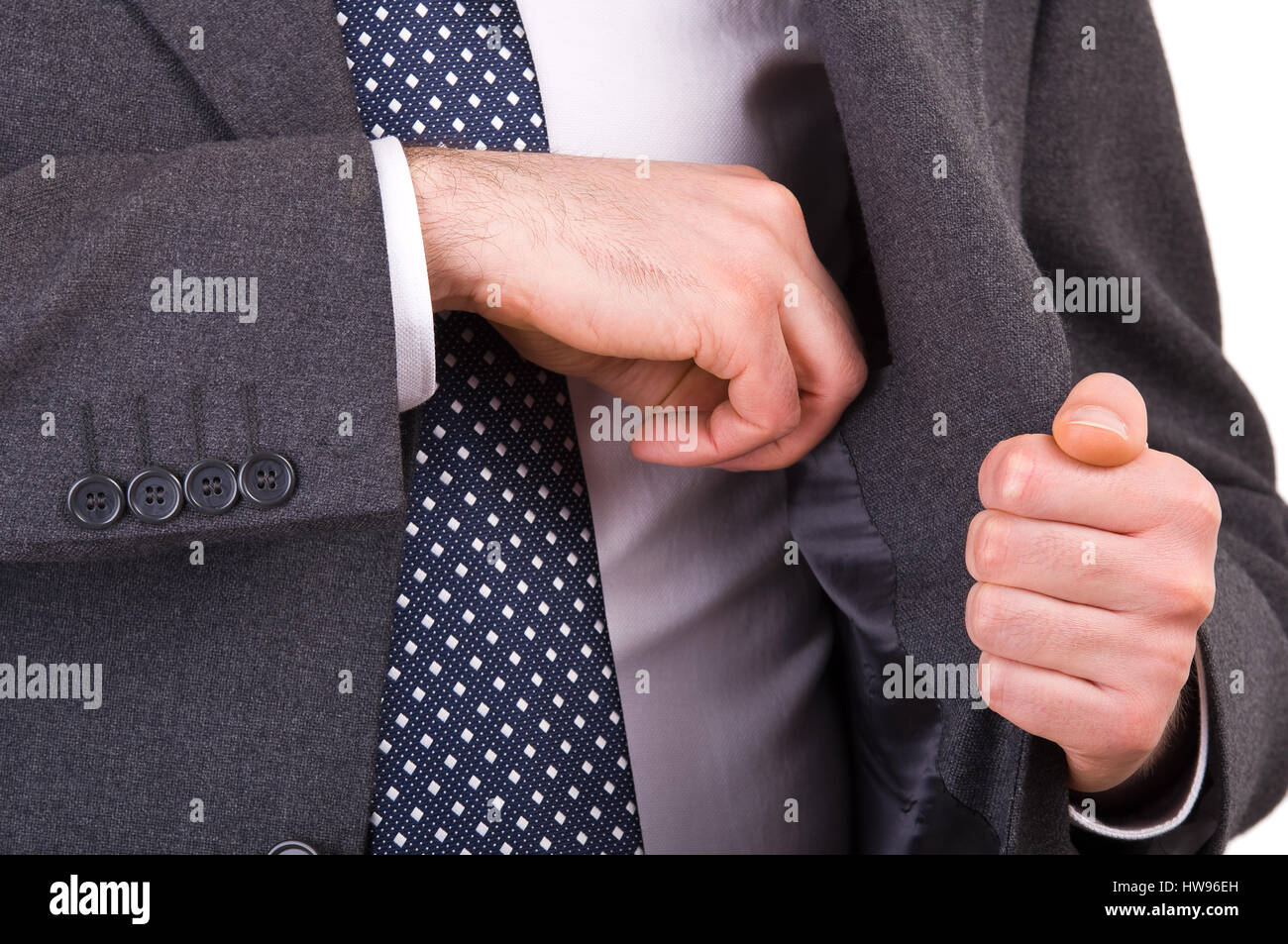Businessman putting something in his pocket Stock Photo - Alamy