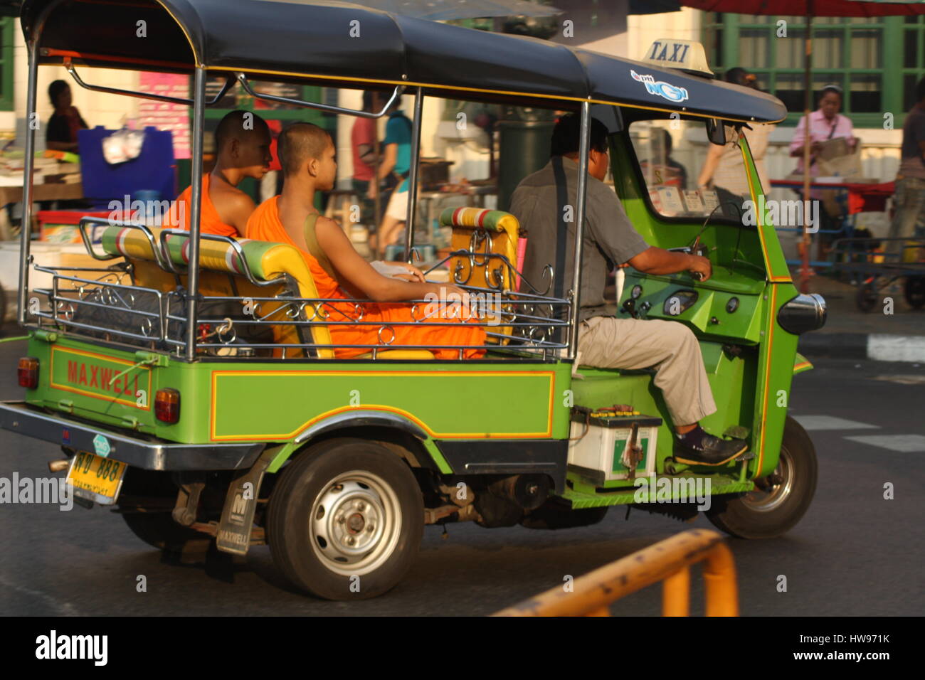 Tuk Tuk driving monks in the streets of Bangkok, Thailand Stock Photo ...