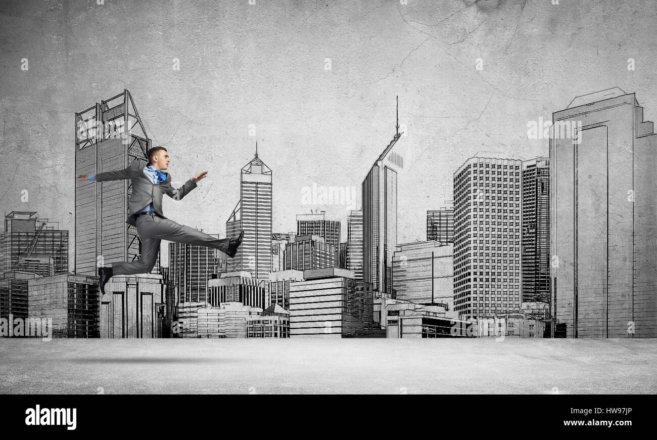 Businessman jumping high Stock Photo - Alamy