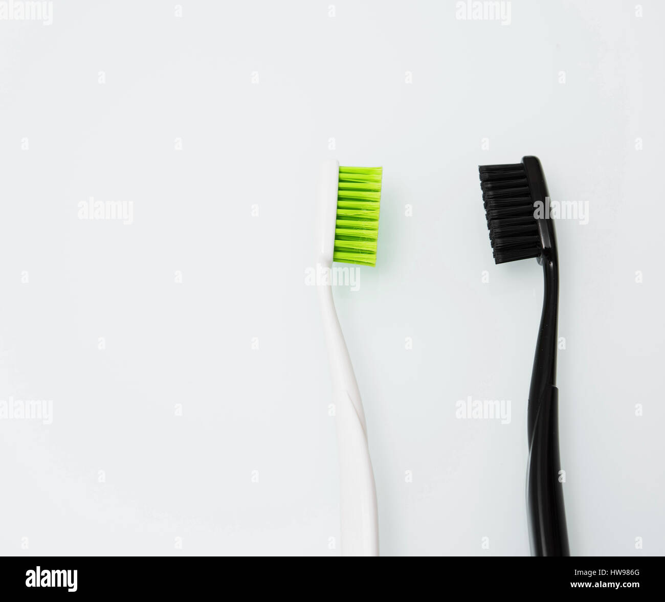 bright toothbrushes on a white table Stock Photo - Alamy