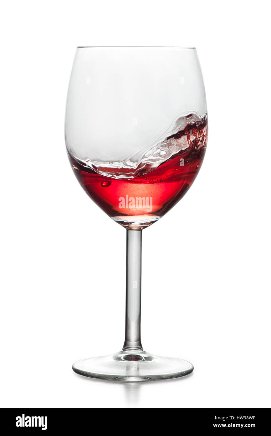 Moving red wine glass over a white background Stock Photo - Alamy