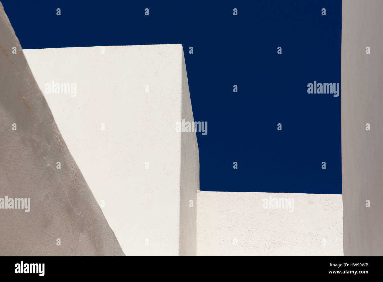 Abstract architectural background of angular white walls on a ...