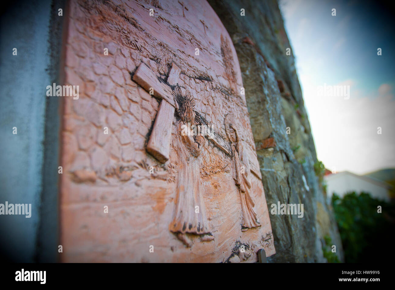 Stone carving of Christ carrying the cross to his crucifixion mounted ...