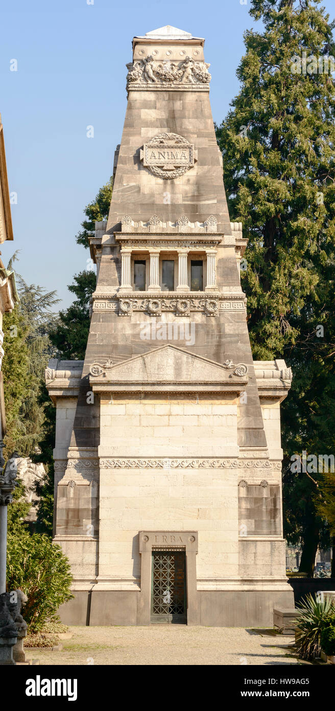 view of tall decorated mausoleum among trees at large monumental ...