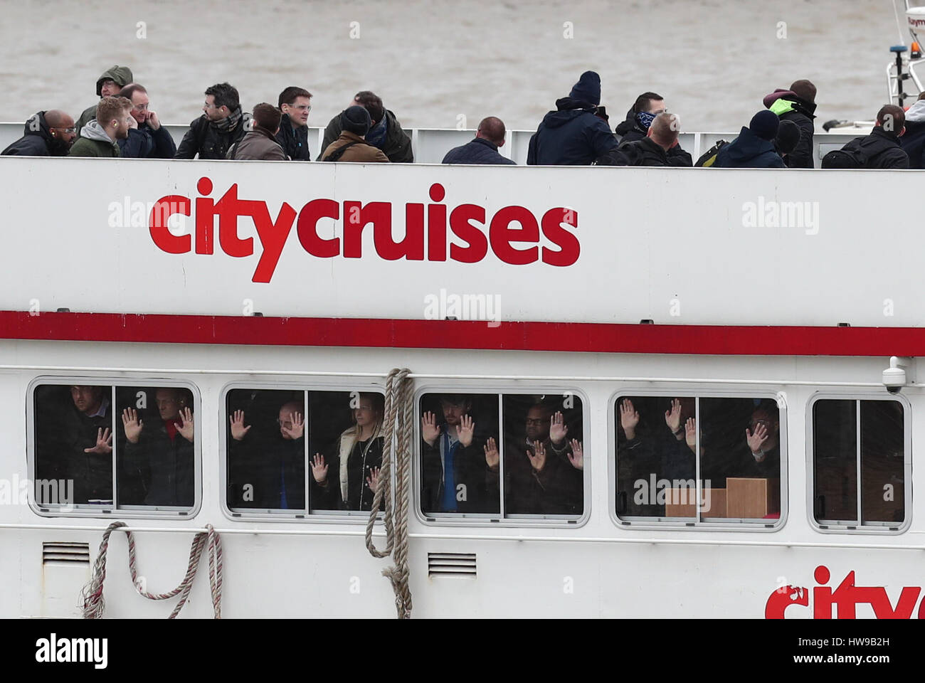 People with the hands up in a boat during a multi-agency exercise ...