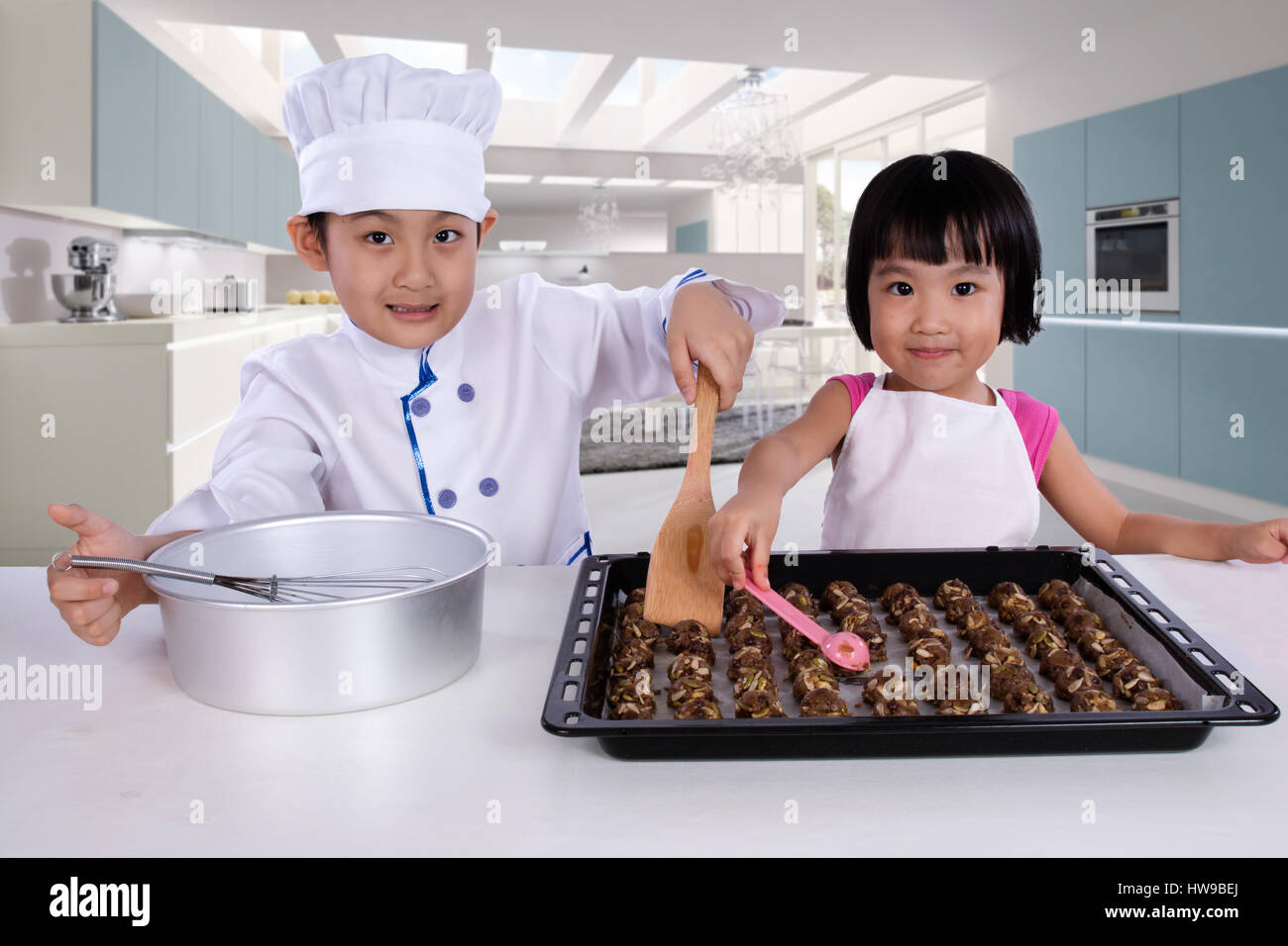 Asian Chinese Kid Baking Cookies against Kitchen Background Stock Photo ...