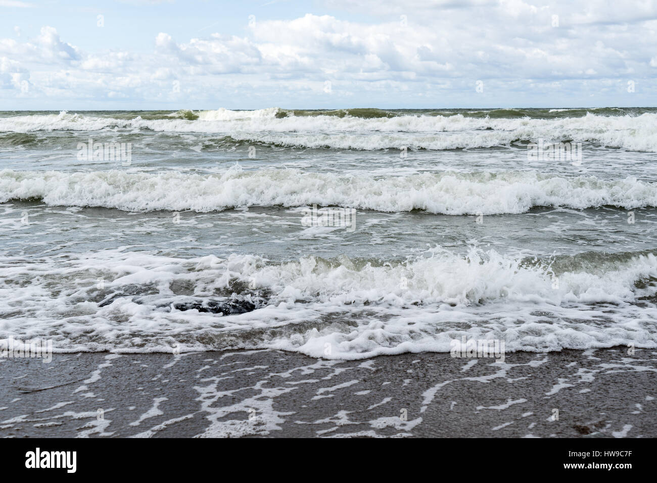 water waves rushing in sand Stock Photo - Alamy