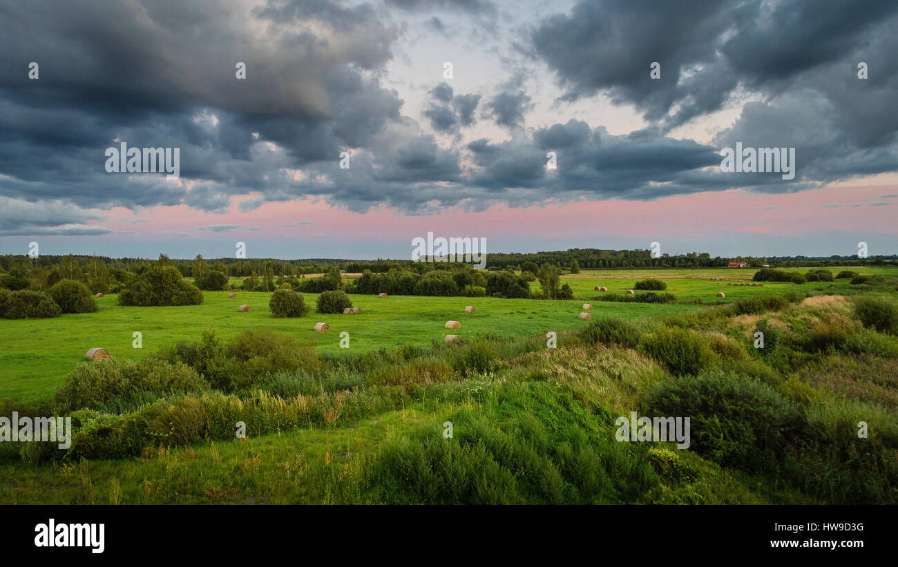 countryside fields in early spring with clouds and farmland Stock Photo ...