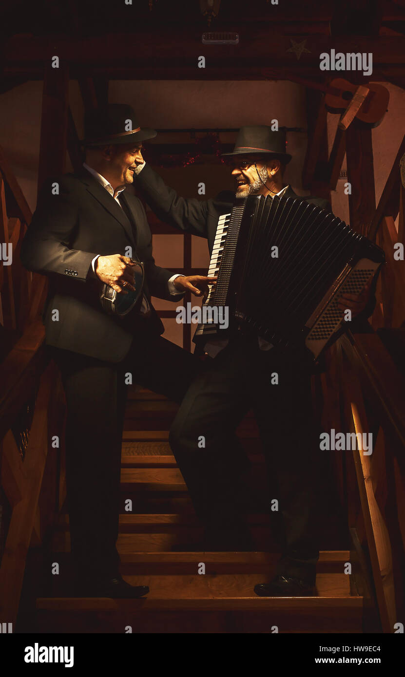 Portraits of percussionist and accordionist with instruments on ...