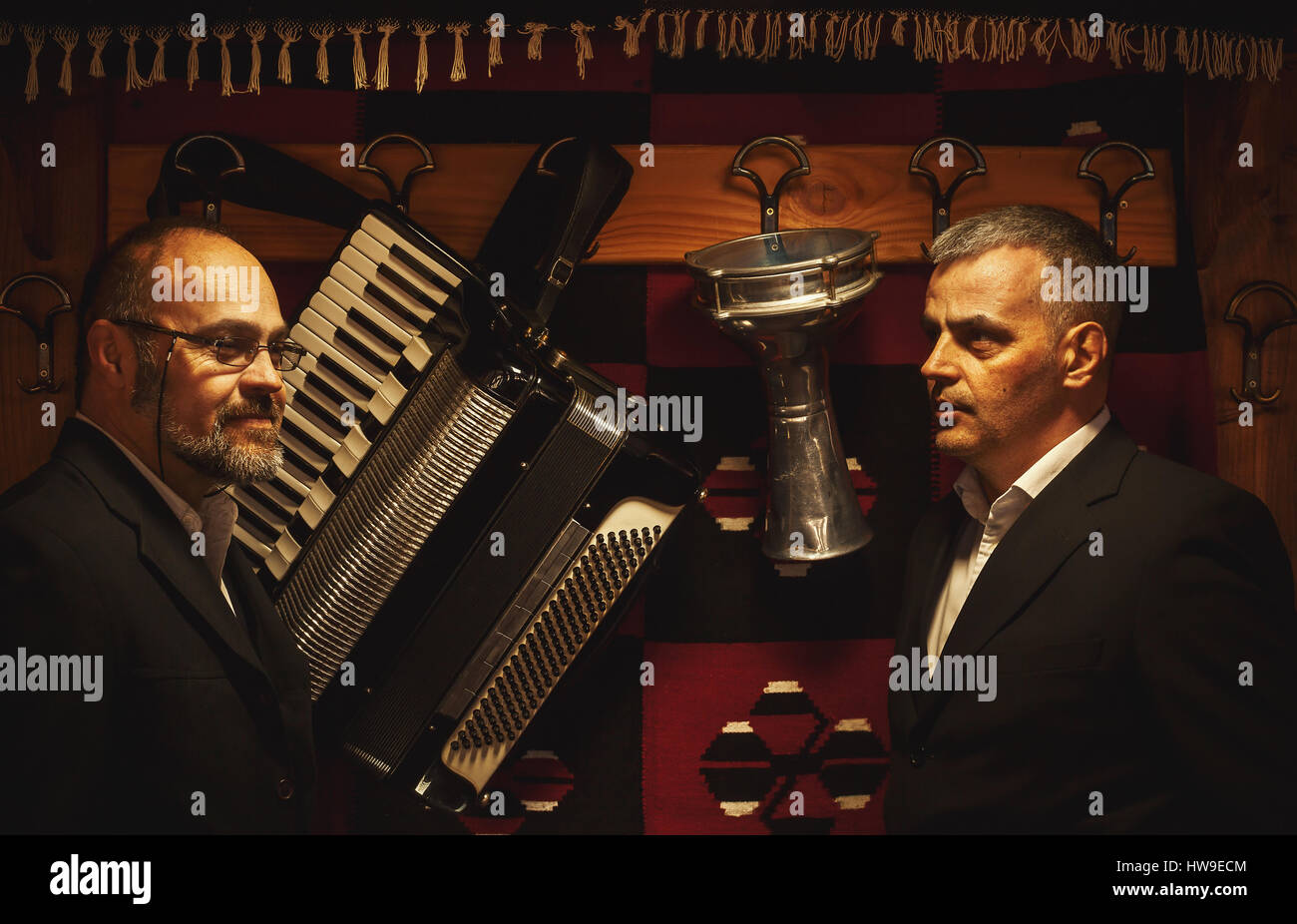 Portraits of percussionist and accordionist in front of their ...