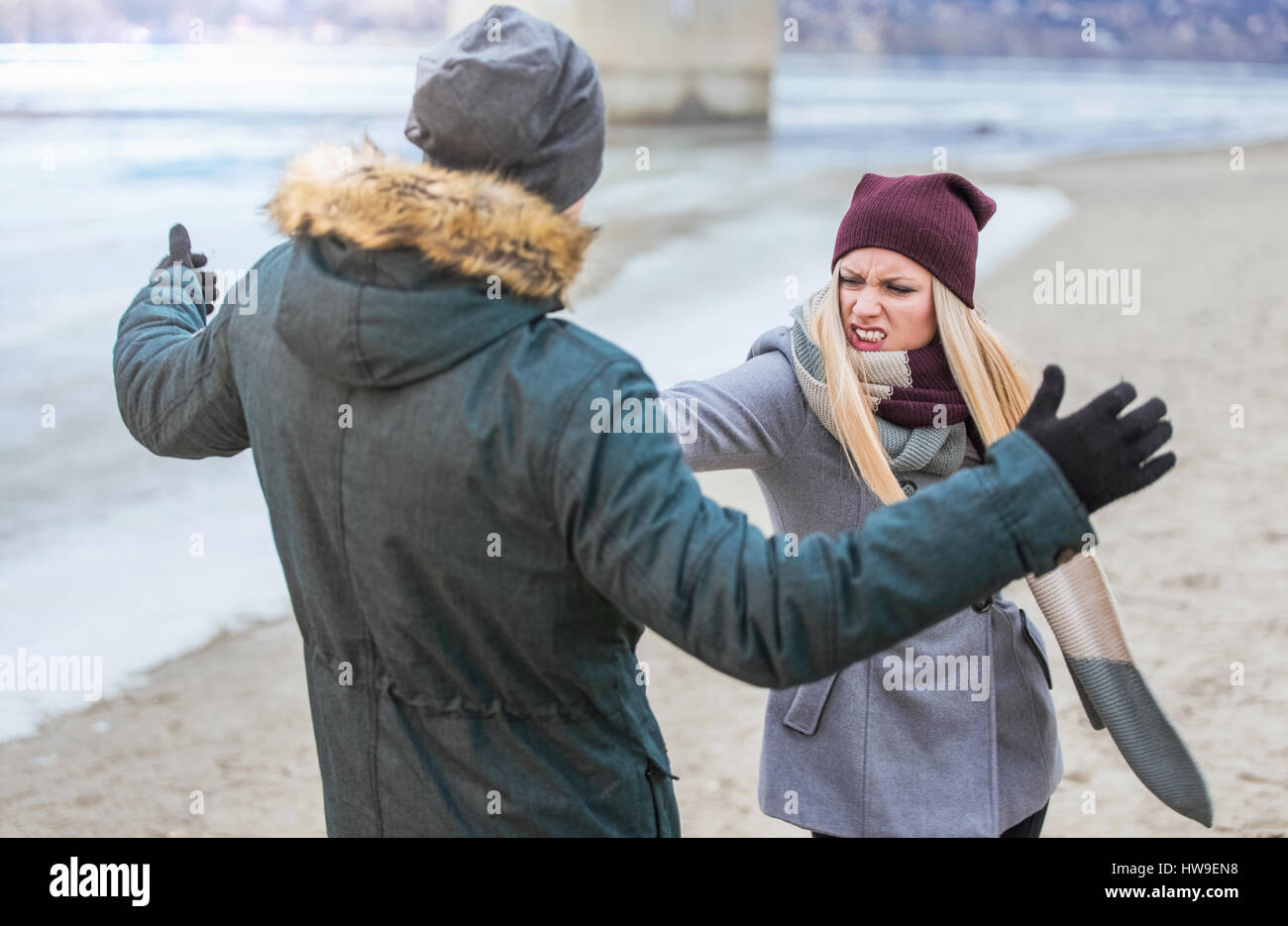 Young woman hitting her boyfriend Stock Photo - Alamy