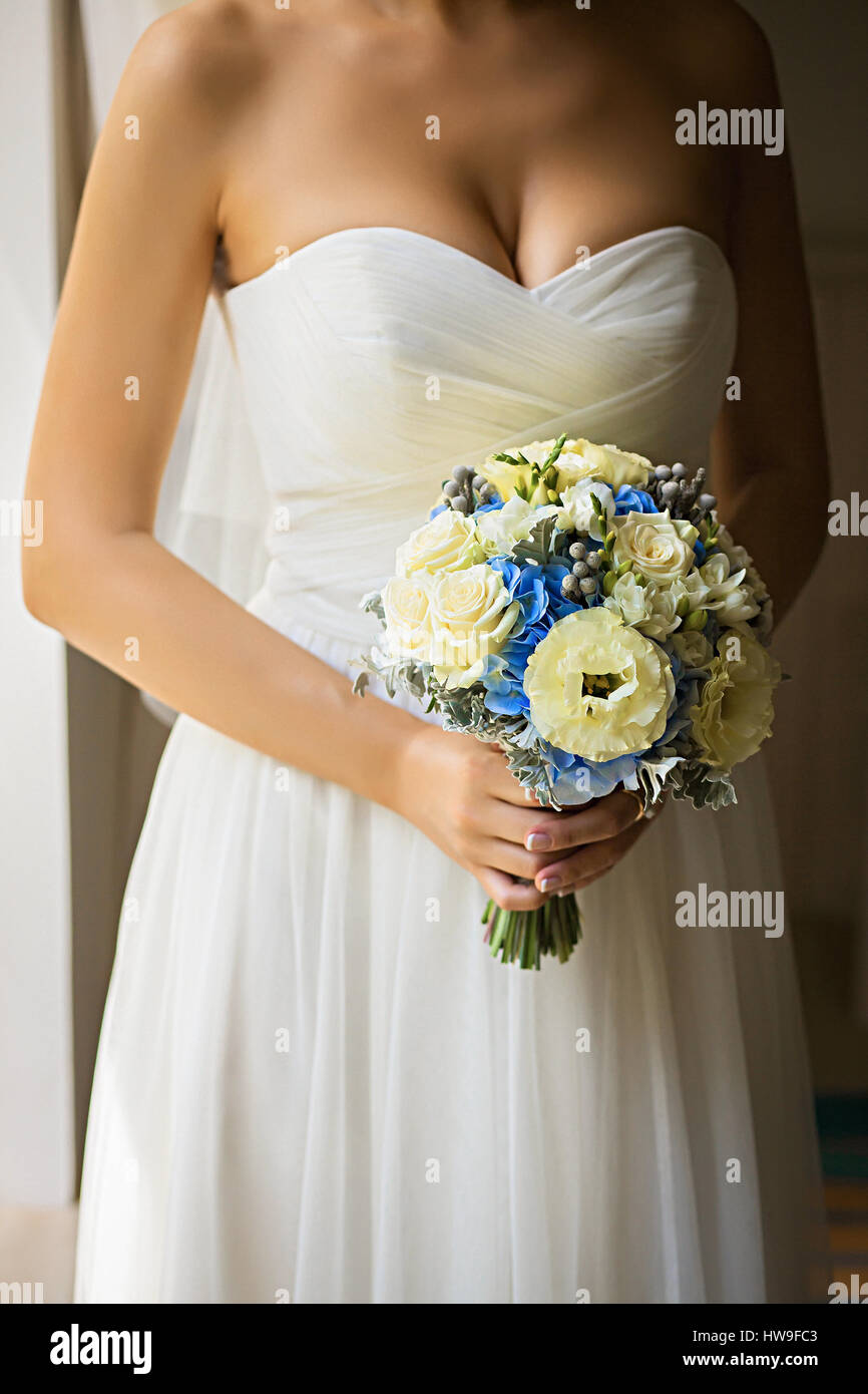 Bride holding delicate marriage bouquet Stock Photo - Alamy