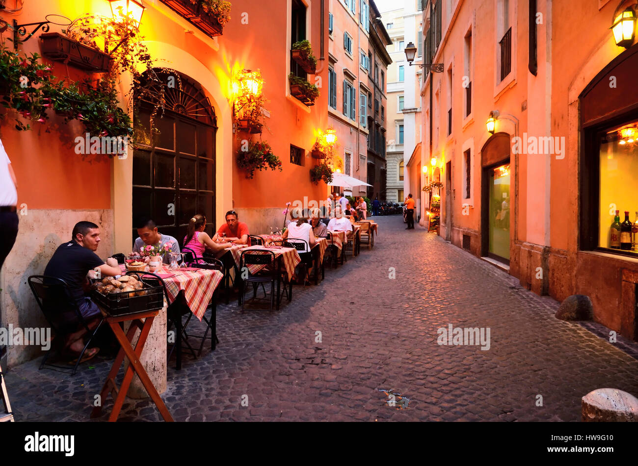 Narrow street with restaurant terrace. Rome, Lazio, Italy, Europe Stock ...
