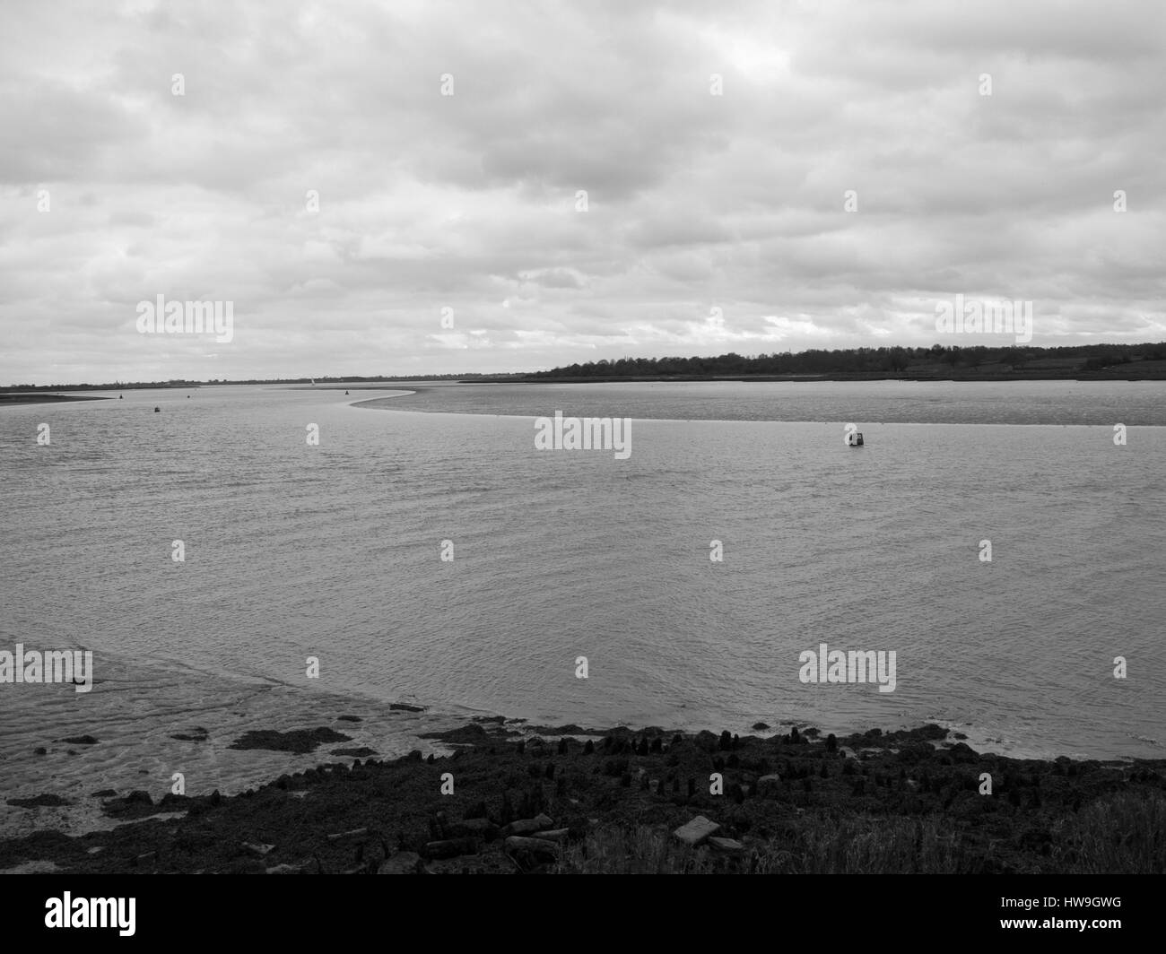 A wide shot of a flowing river with its rocky banks Stock Photo - Alamy