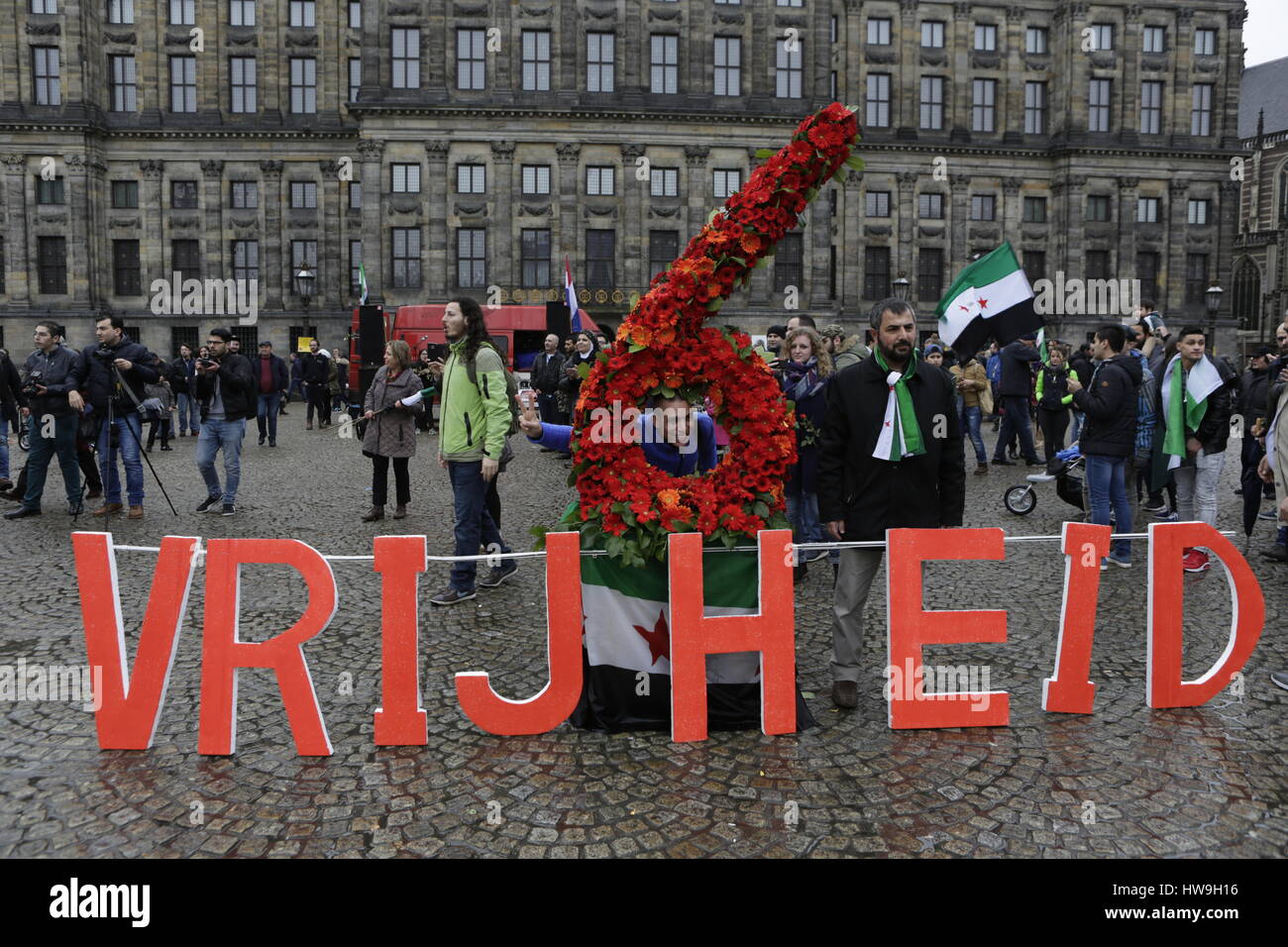 Amsterdam, Netherlands. 18th Mar, 2017. Syrians pose at a number 6 made ...