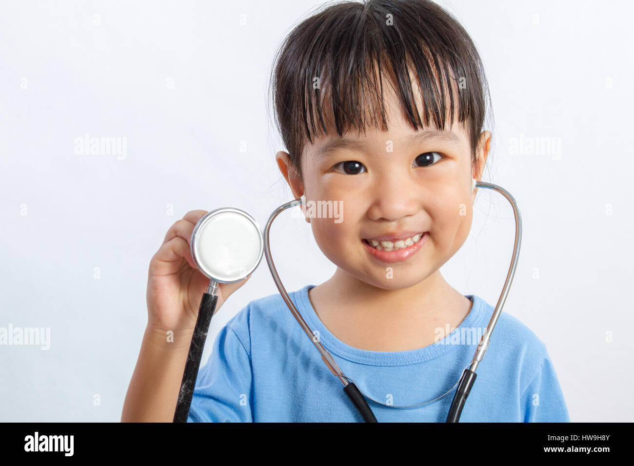 Asian Little Chinese Girl Playing Doctor with a stethoscope isolated on ...