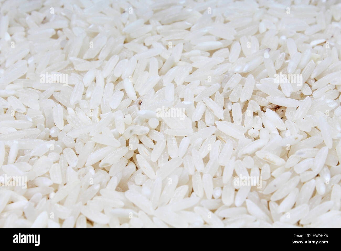 Raw uncooked rice texture Stock Photo - Alamy