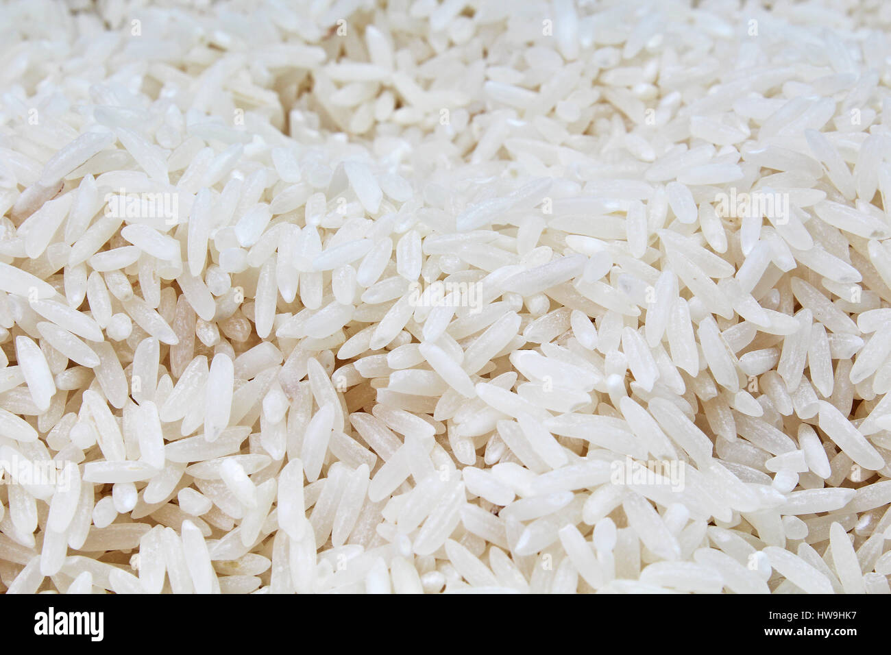 Raw uncooked rice texture Stock Photo - Alamy