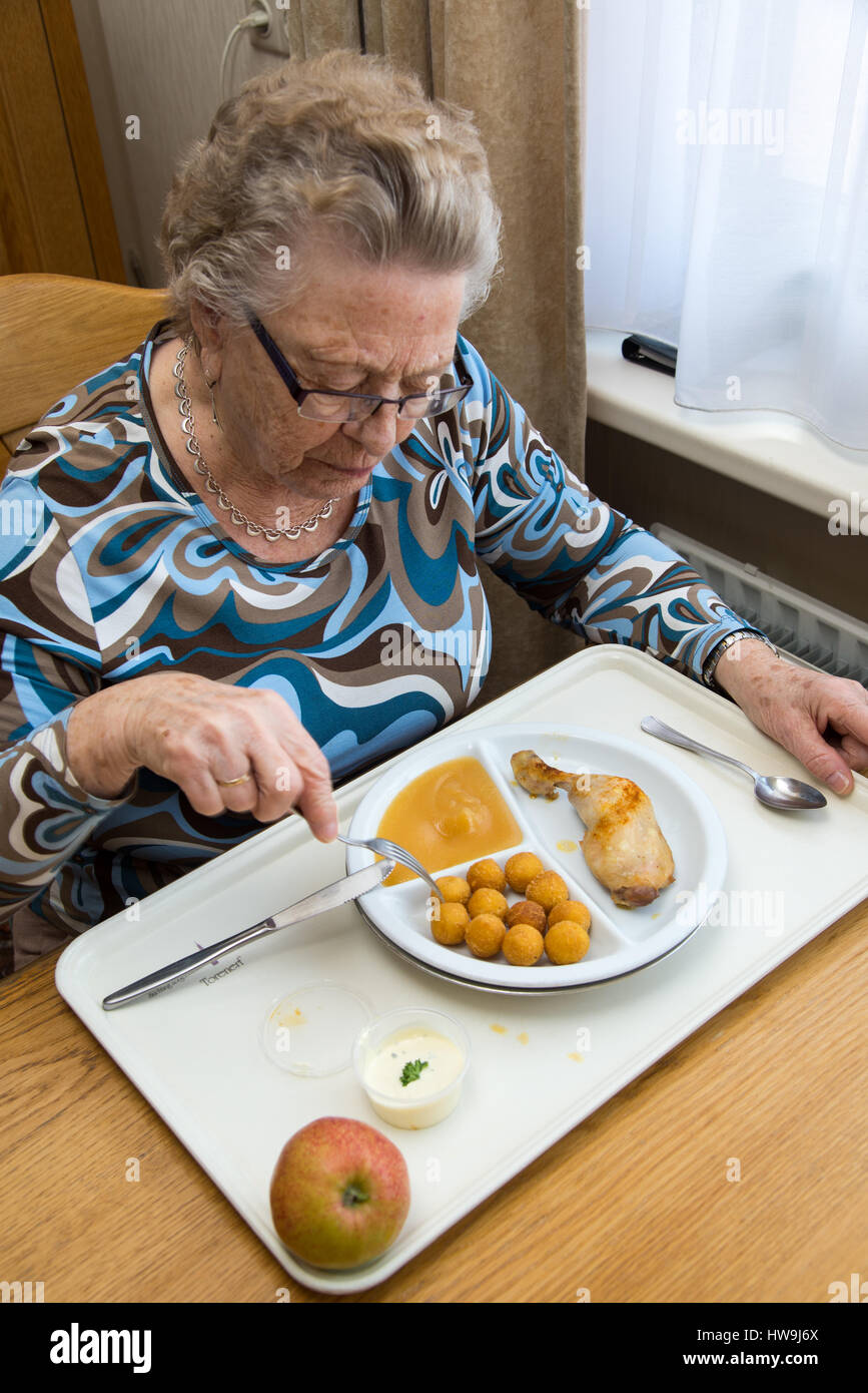 old woman eating at table in house of the elderly Stock Photo - Alamy