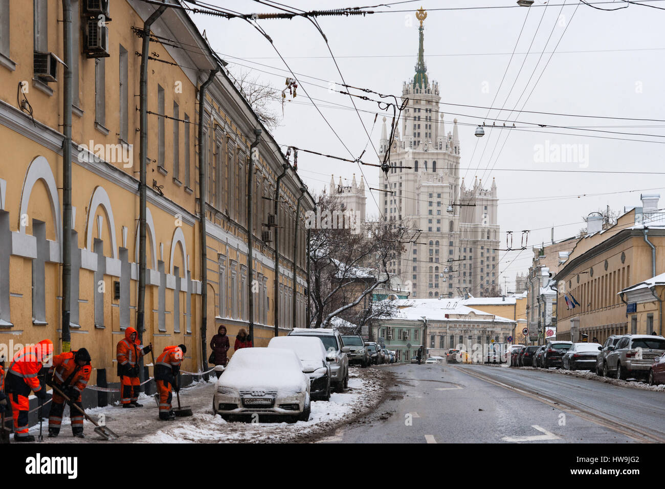 MOSCOW, RUSSIA - JANUARY 13, 2015: Unidentified workers remove snow ...