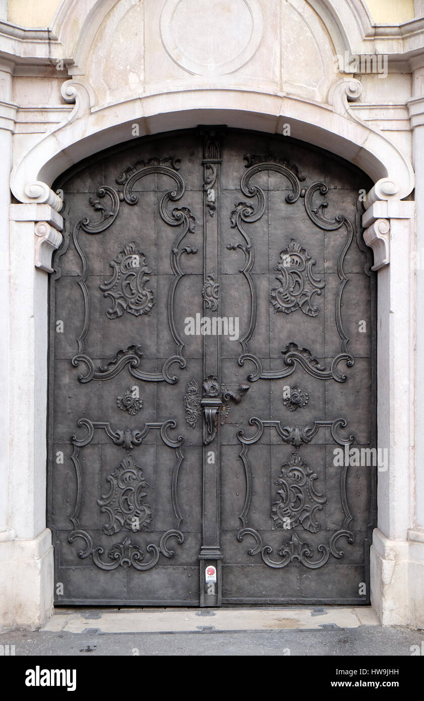 Majestic medieval door with ornate metal pattern and stone columns in ...