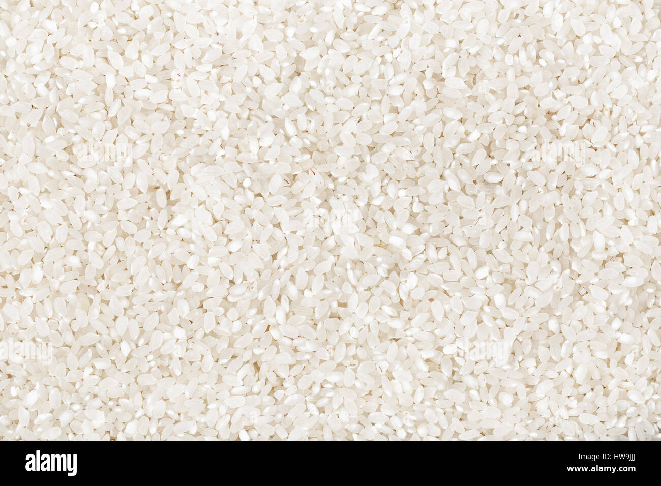 uncooked white round rice background. Grains of rice top view Stock ...