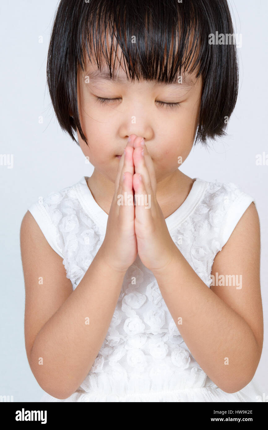 Asian Little Chinese Girl Praying in isolated White Background Stock ...