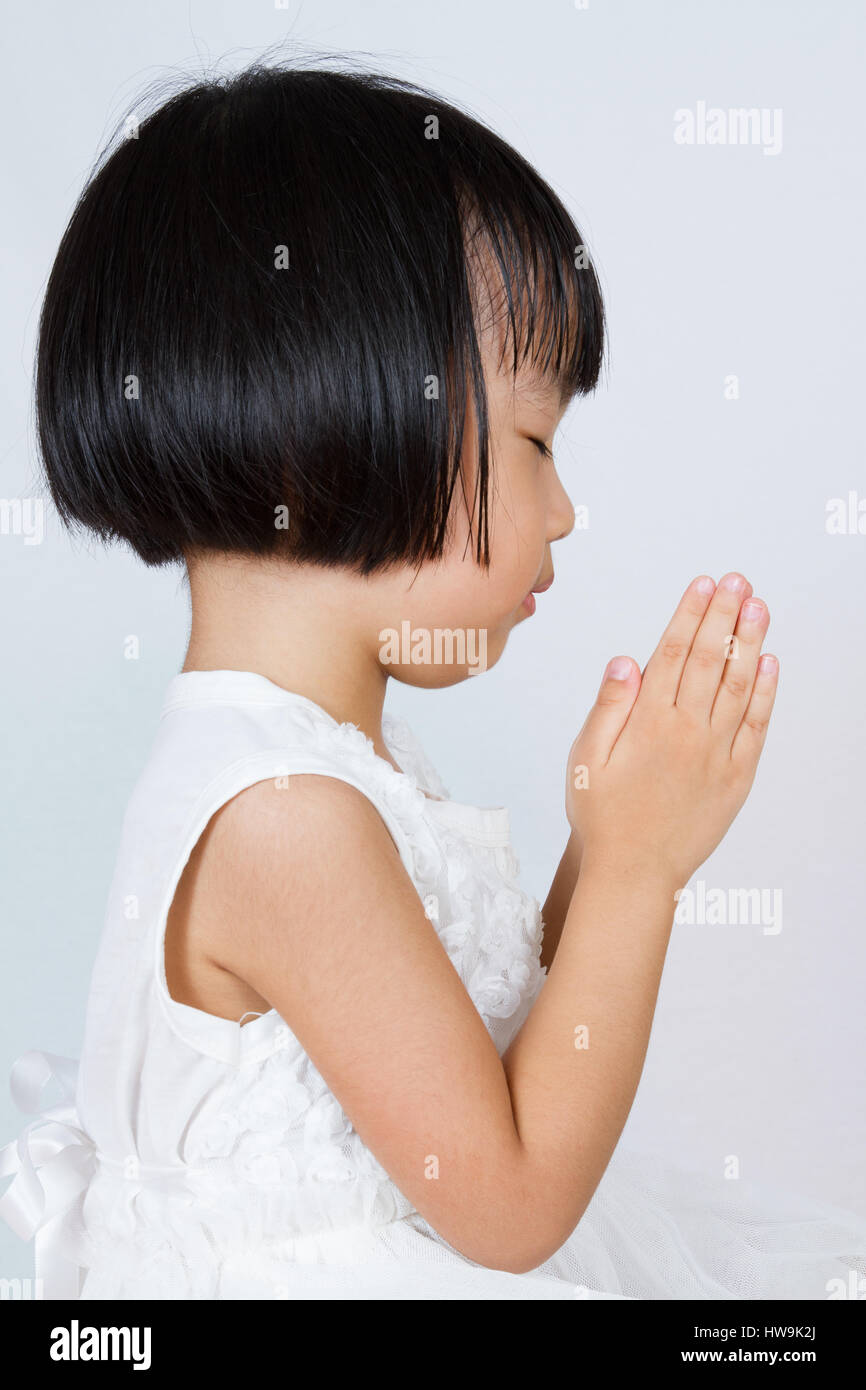 Asian Little Chinese Girl Praying in isolated White Background Stock ...