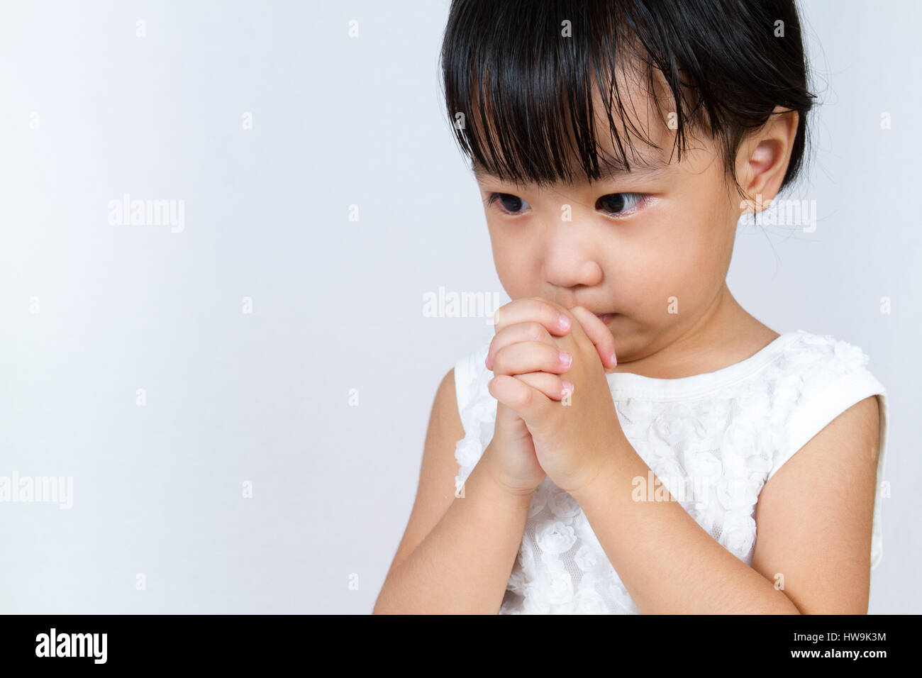 Asian Little Chinese Girl Praying in isolated White Background Stock ...