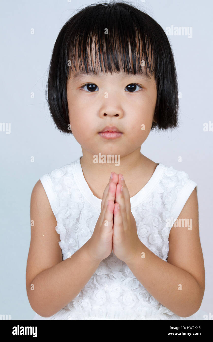 Asian Little Chinese Girl Praying in isolated White Background Stock ...
