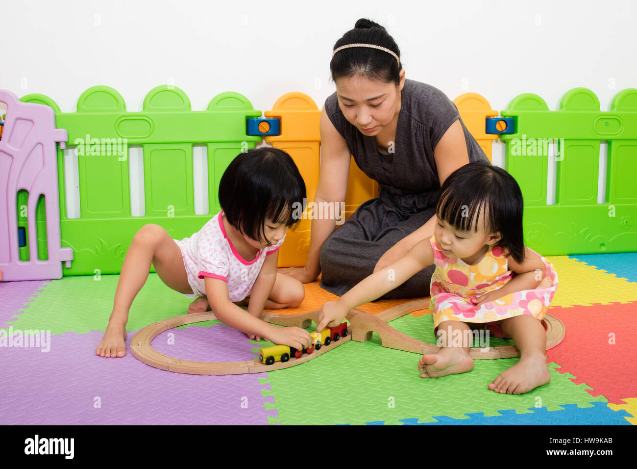 Asian Kids and Mother Playing Together at Playground Stock Photo - Alamy