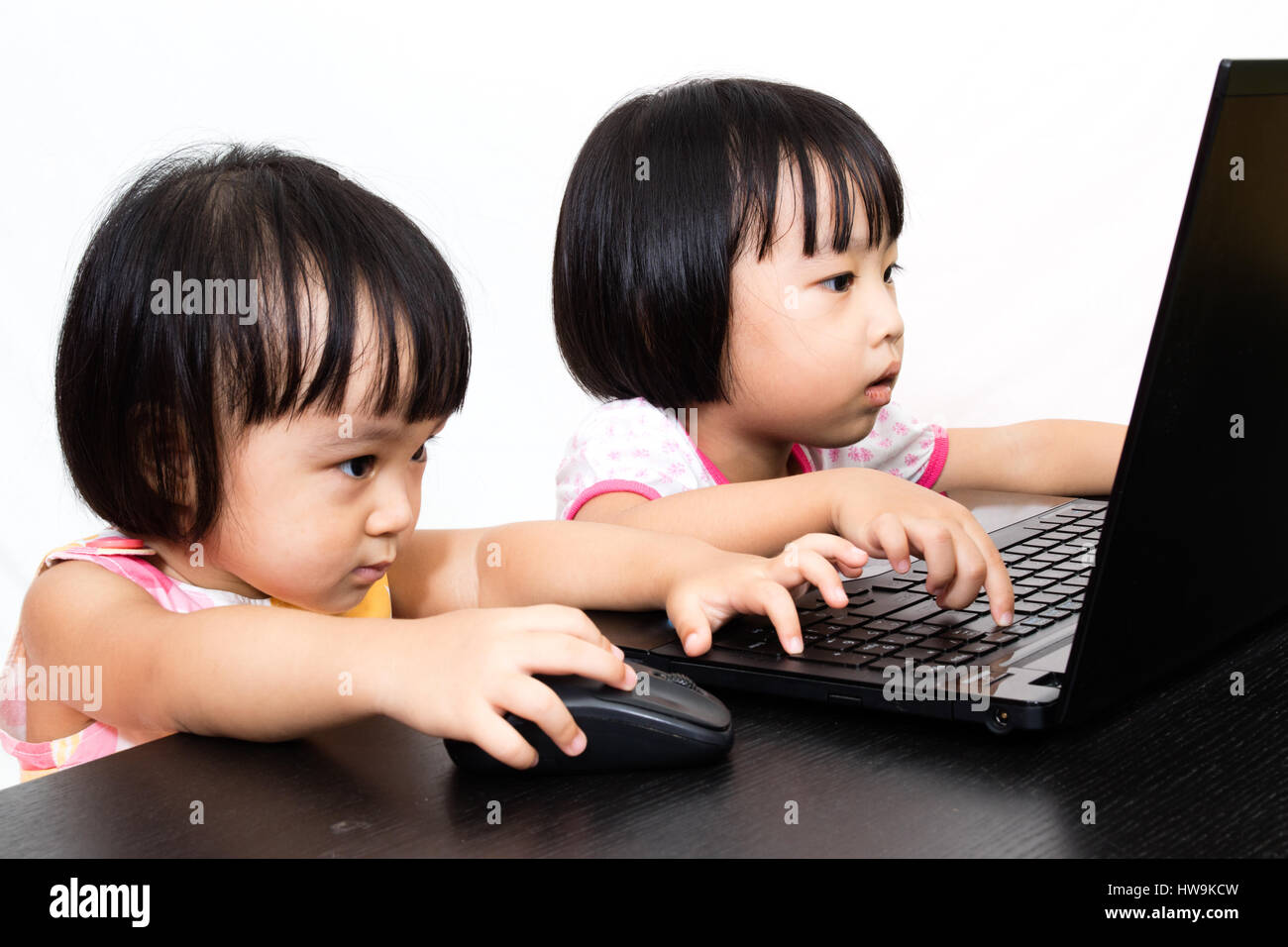 Asian Little Chinese Girls Playing Laptop Computer in Isolated White ...