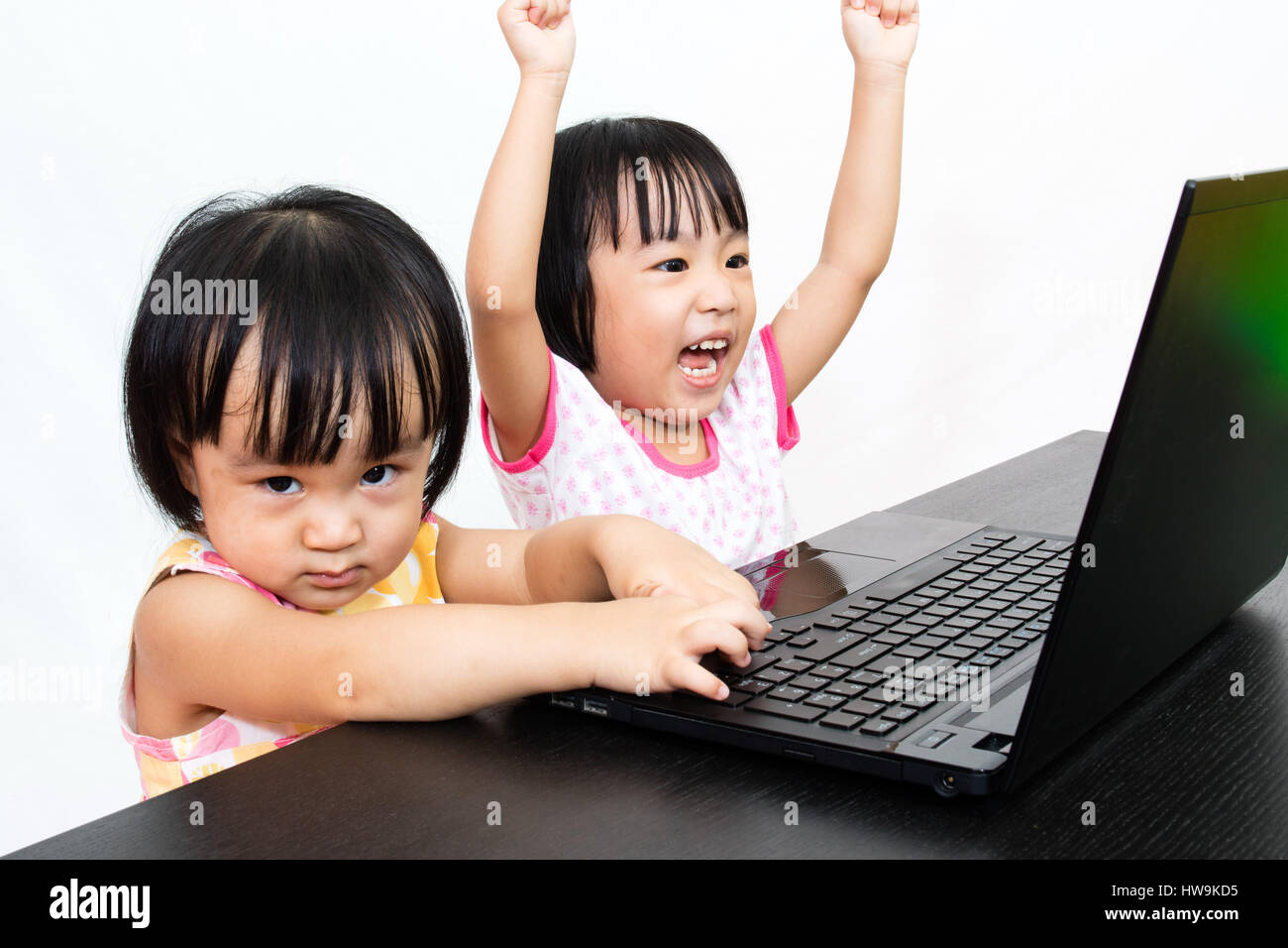 Asian Little Chinese Girls Playing Laptop Computer in Isolated White ...