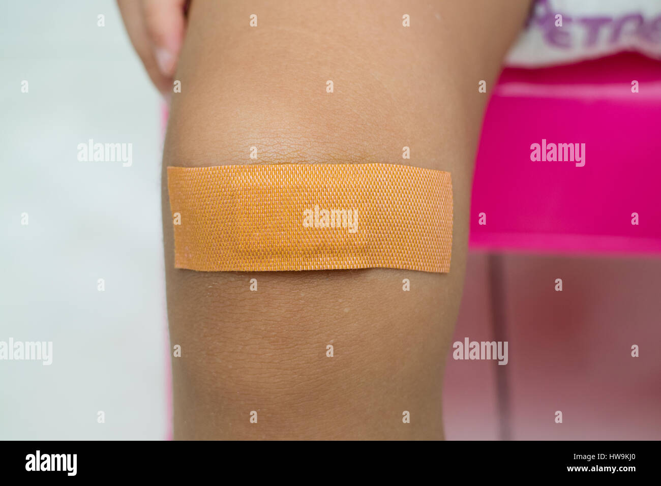 Child with Band Aid on Knee Close Up Stock Photo - Alamy