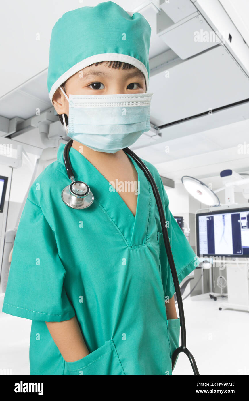 Asian Little Chinese Girl Playing a Doctor with Mask and Stethoscope in ...