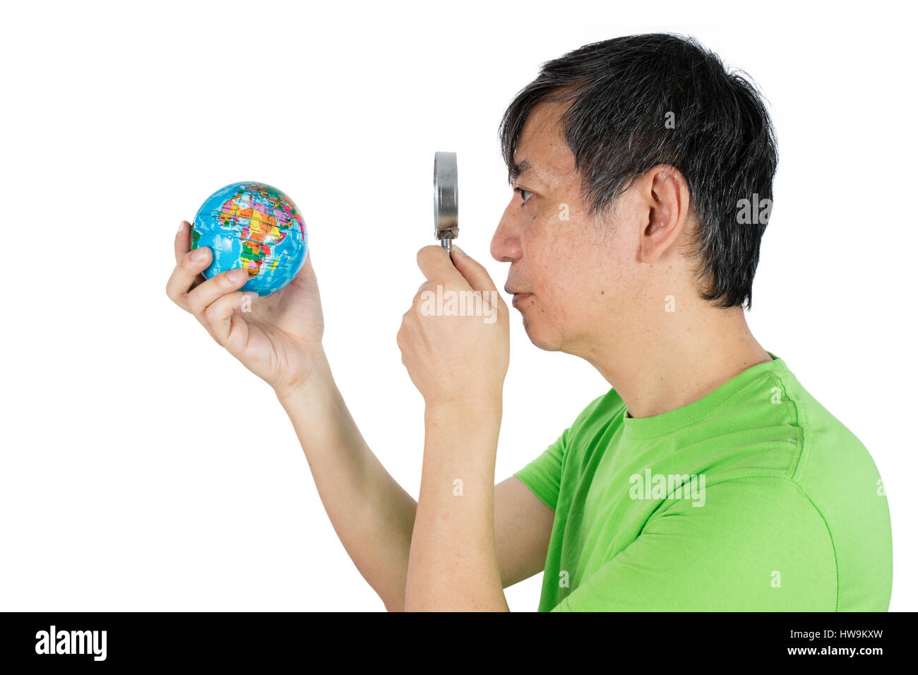 Magnifying glass examining earth hi-res stock photography and images ...