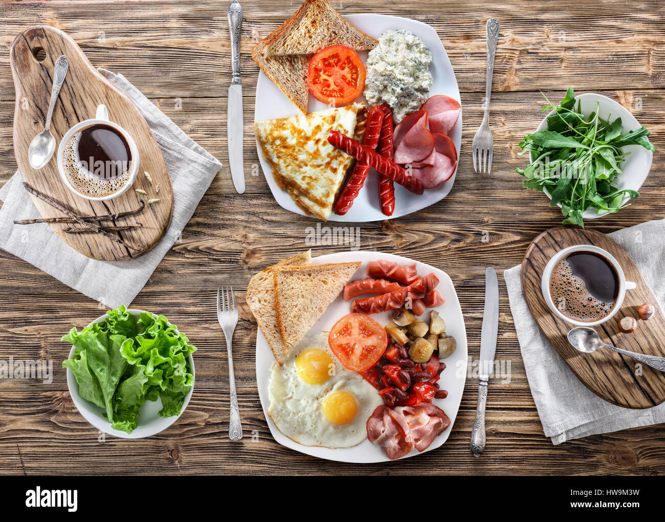 Traditional breakfast at home. Top view of table and people who having ...